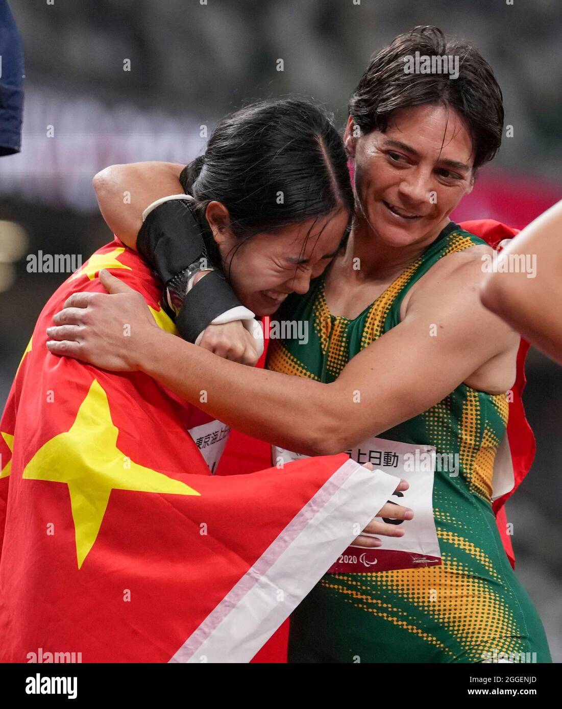 Tokyo, Japan. 31st Aug, 2021. Jiang Fenfen (L) of China reacts with ...