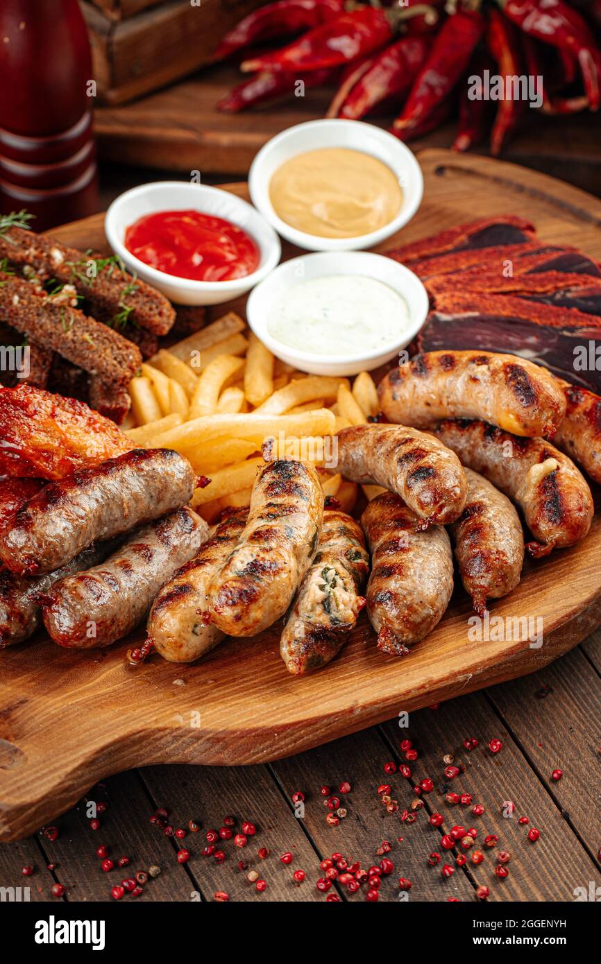 Wooden tray of beer appetizers set assortment Stock Photo - Alamy