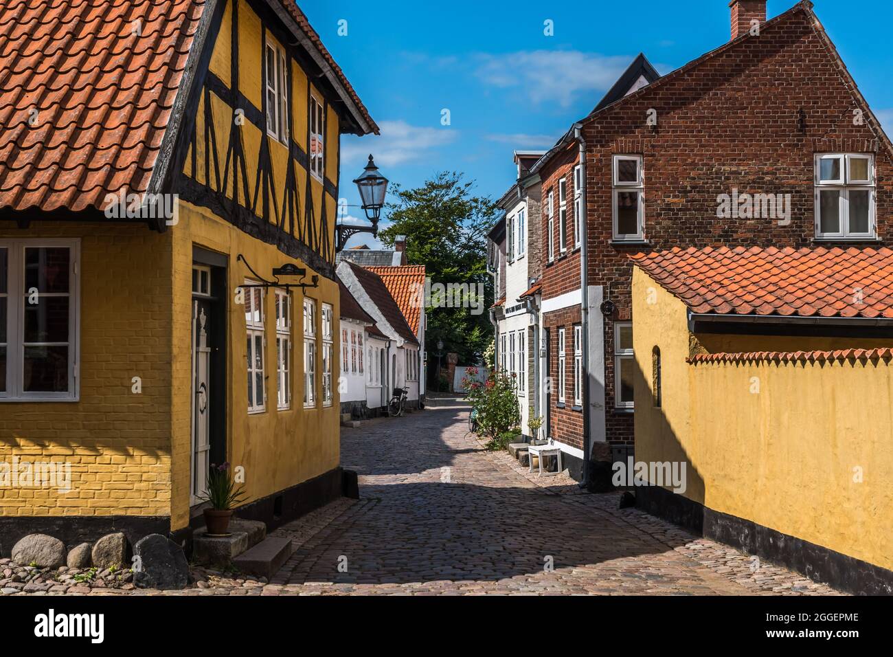 Ribe, Denmark - August 4, 2021: A small street in Denmark's oldest city ...
