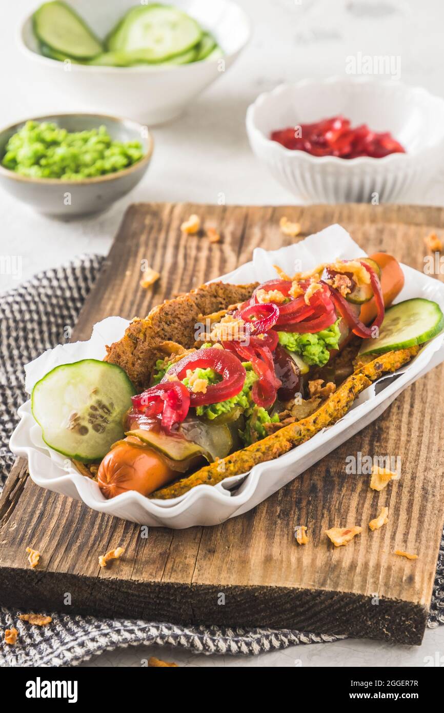 Healthy vegetarian hot dog with flatbread made from vegetables, topped ...
