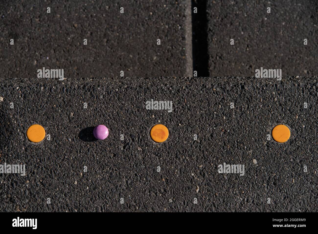 Top view of small orange dots on a rough concrete surface Stock Photo ...