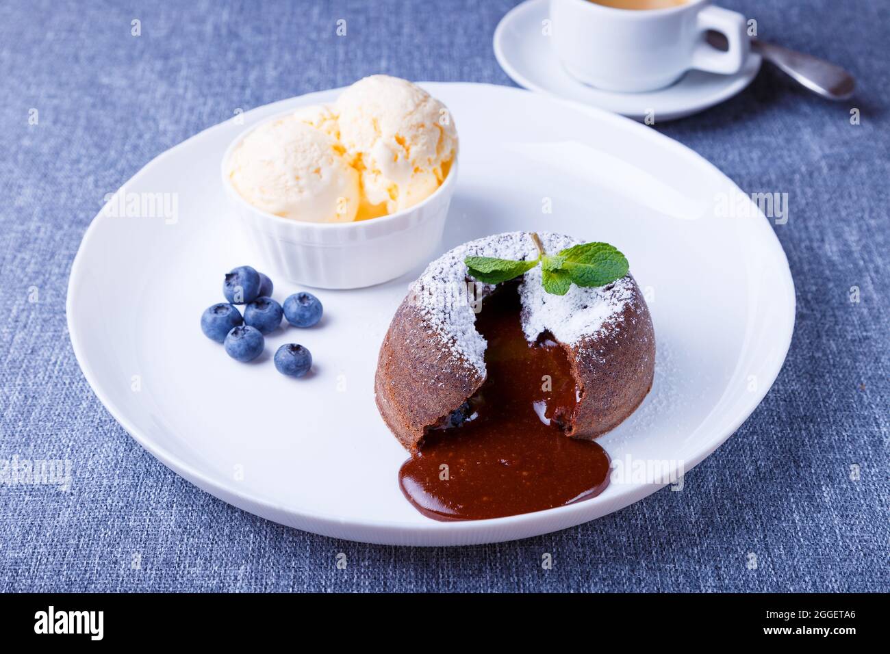 Lava cake with dripping filling. Chocolate fondant cake with vanilla ...