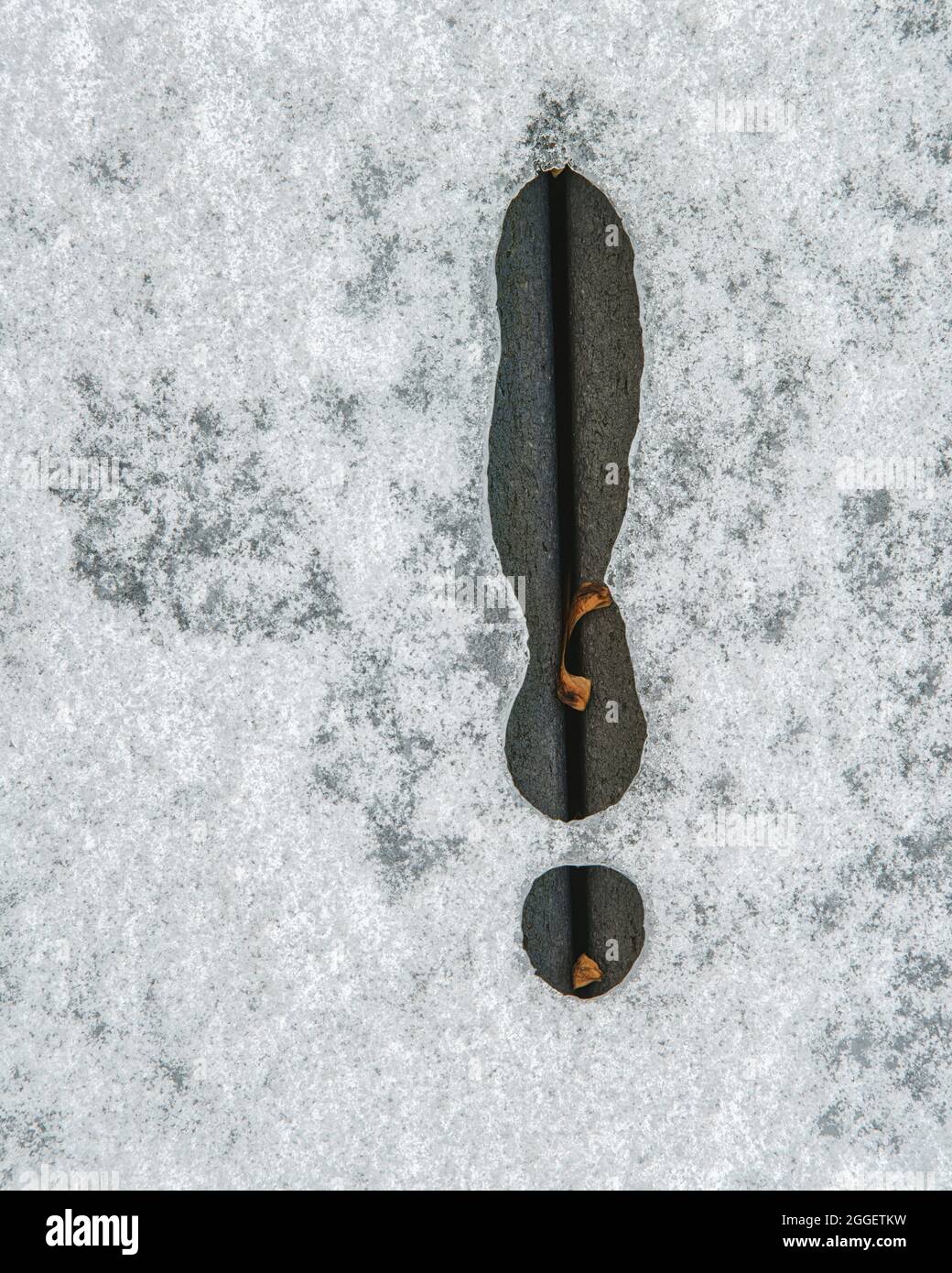 Frozen snow forms an exclamation point Stock Photo - Alamy