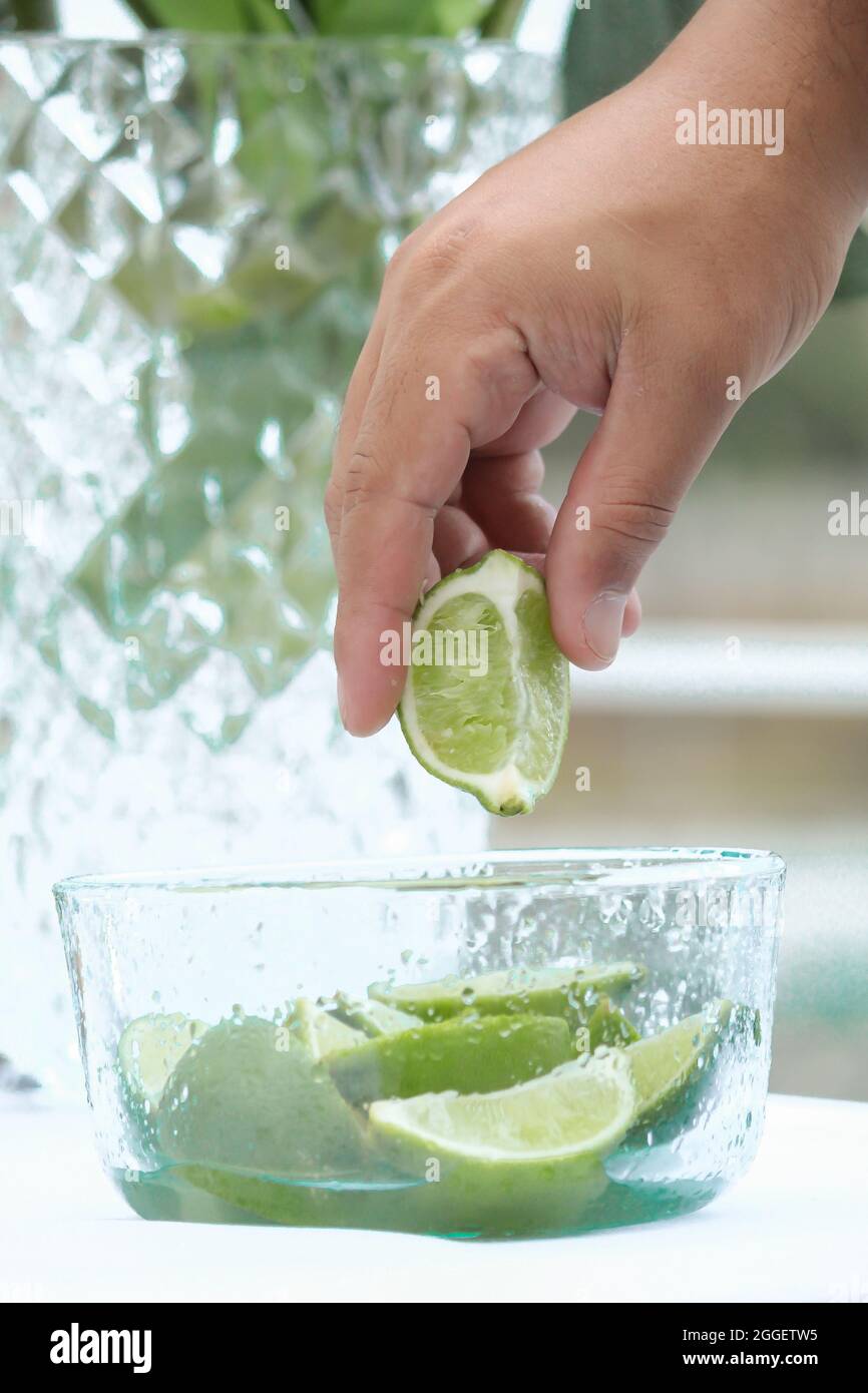 Mans hand squeezing slice hi-res stock photography and images - Alamy