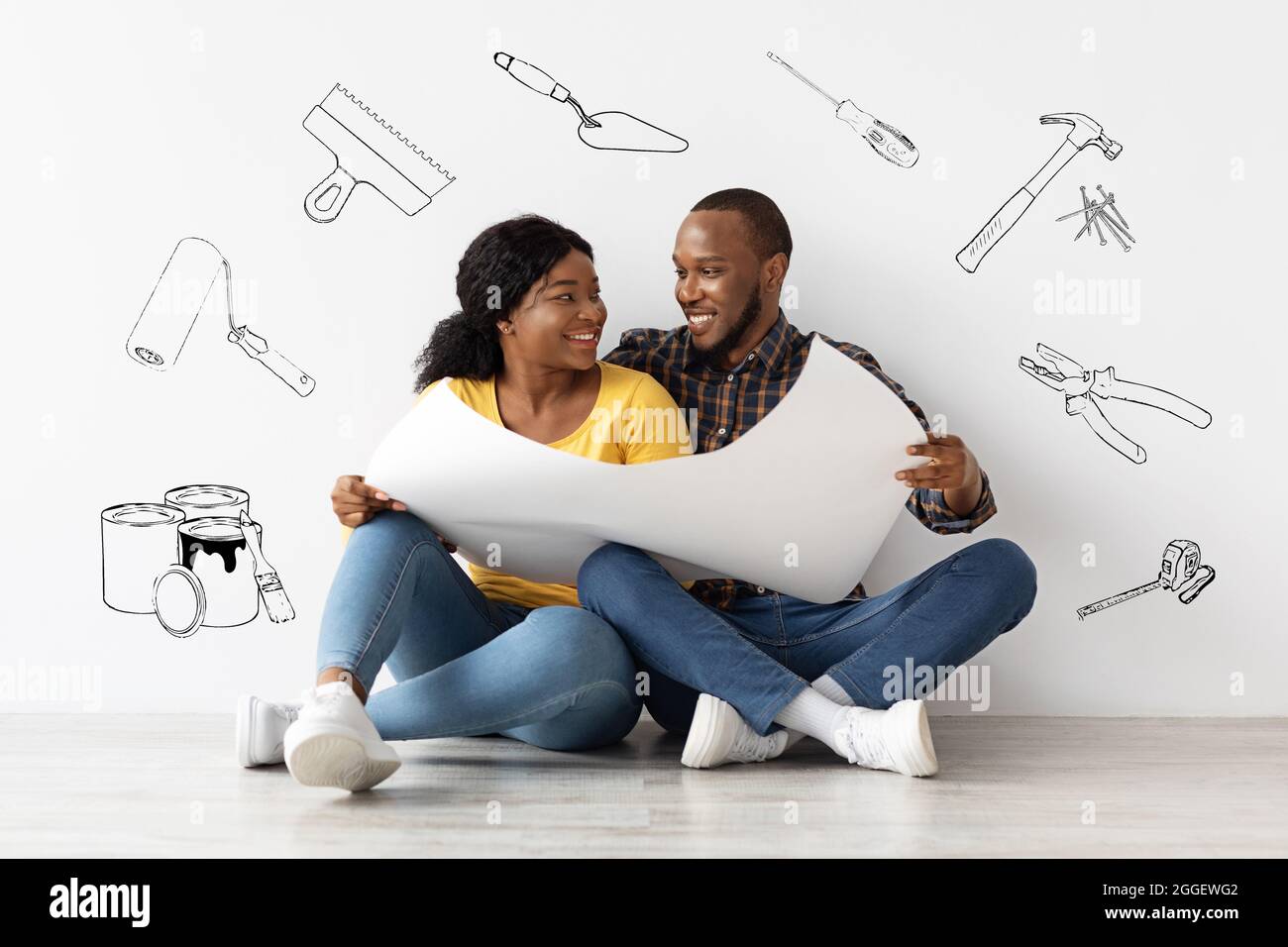 Cheerful Black Couple Planning Home Renovation Together, Holding ...