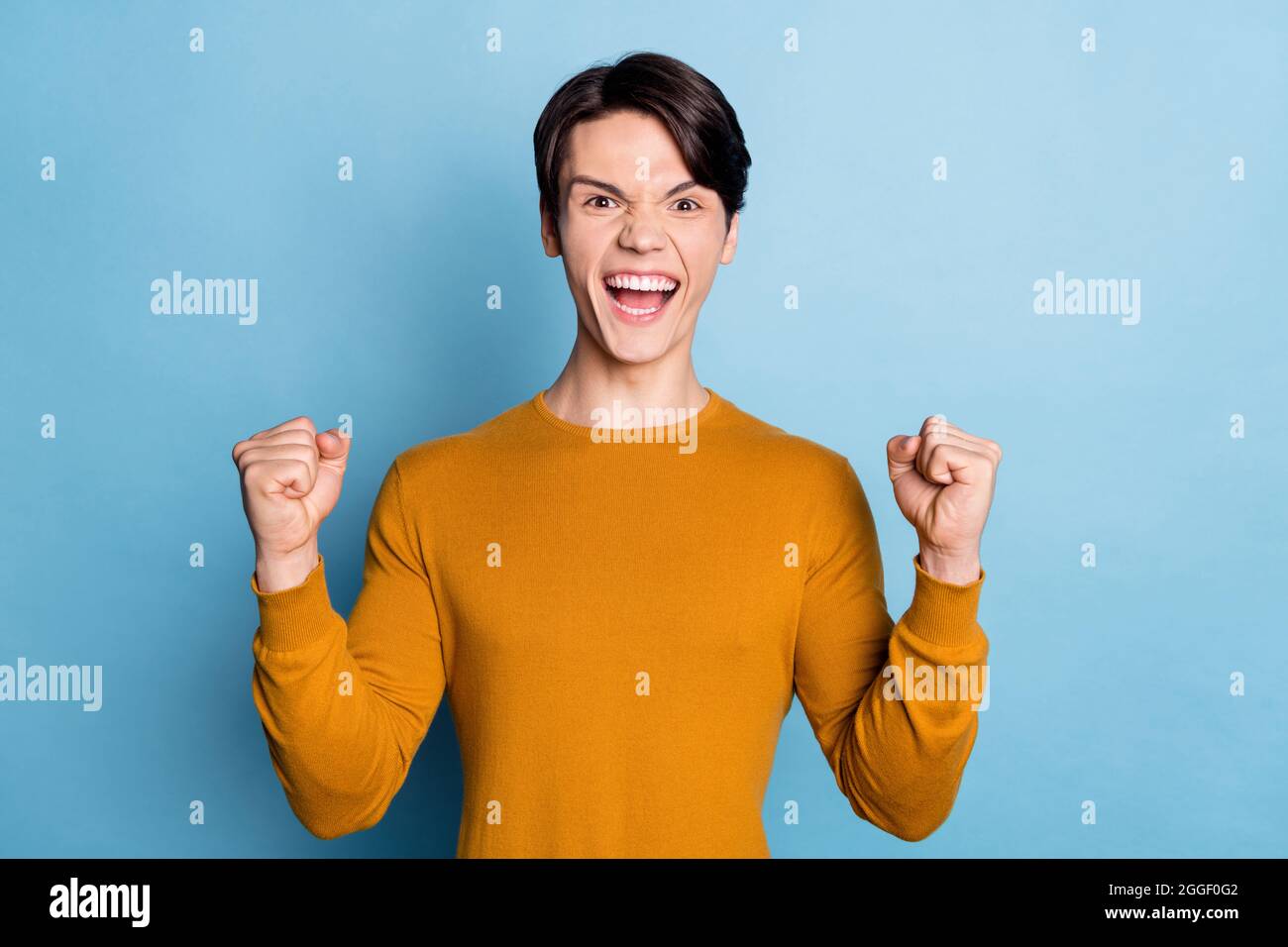 Photo of young guy happy positive smile rejoice win winner victory ...