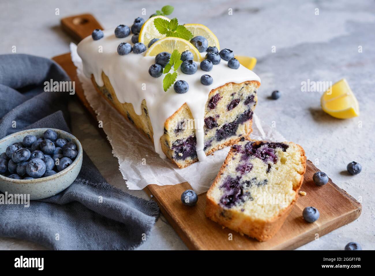Fresh lemon blueberry loaf of bread cake with sugar glaze Stock Photo ...
