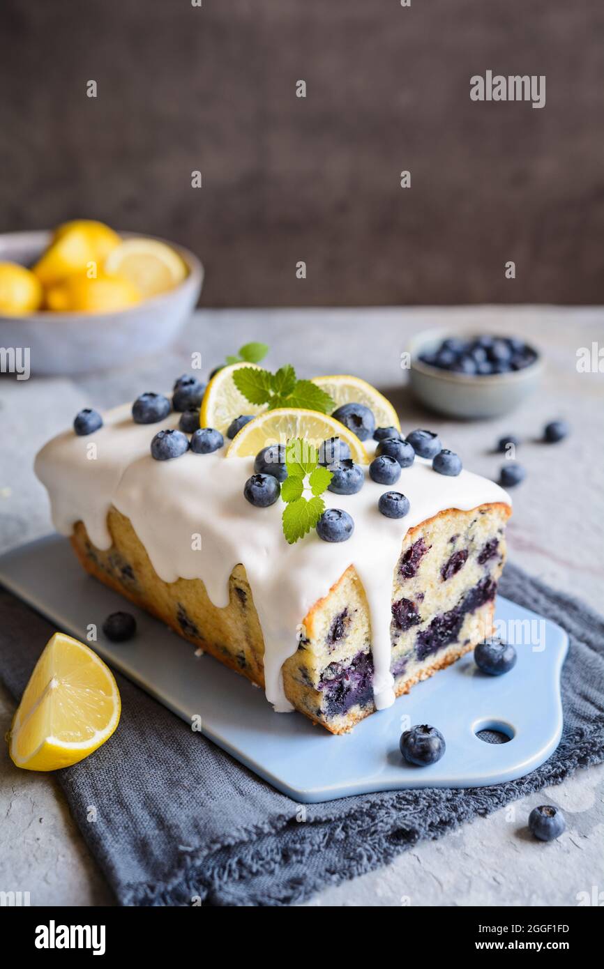 Fresh lemon blueberry loaf of bread cake with sugar glaze Stock Photo ...