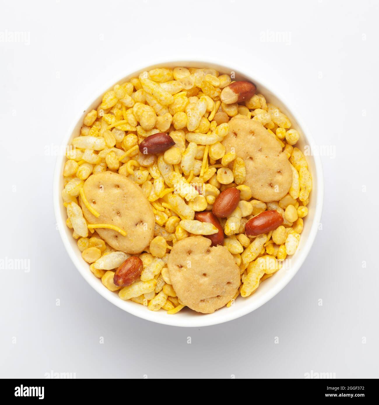 Close up of Bhel puri Indian namkeen (snacks) on a ceramic white bowl ...