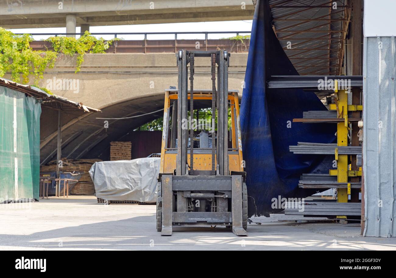 Front View of Forklift and Metal Shelf With Steel Profiles Tubes Stock ...