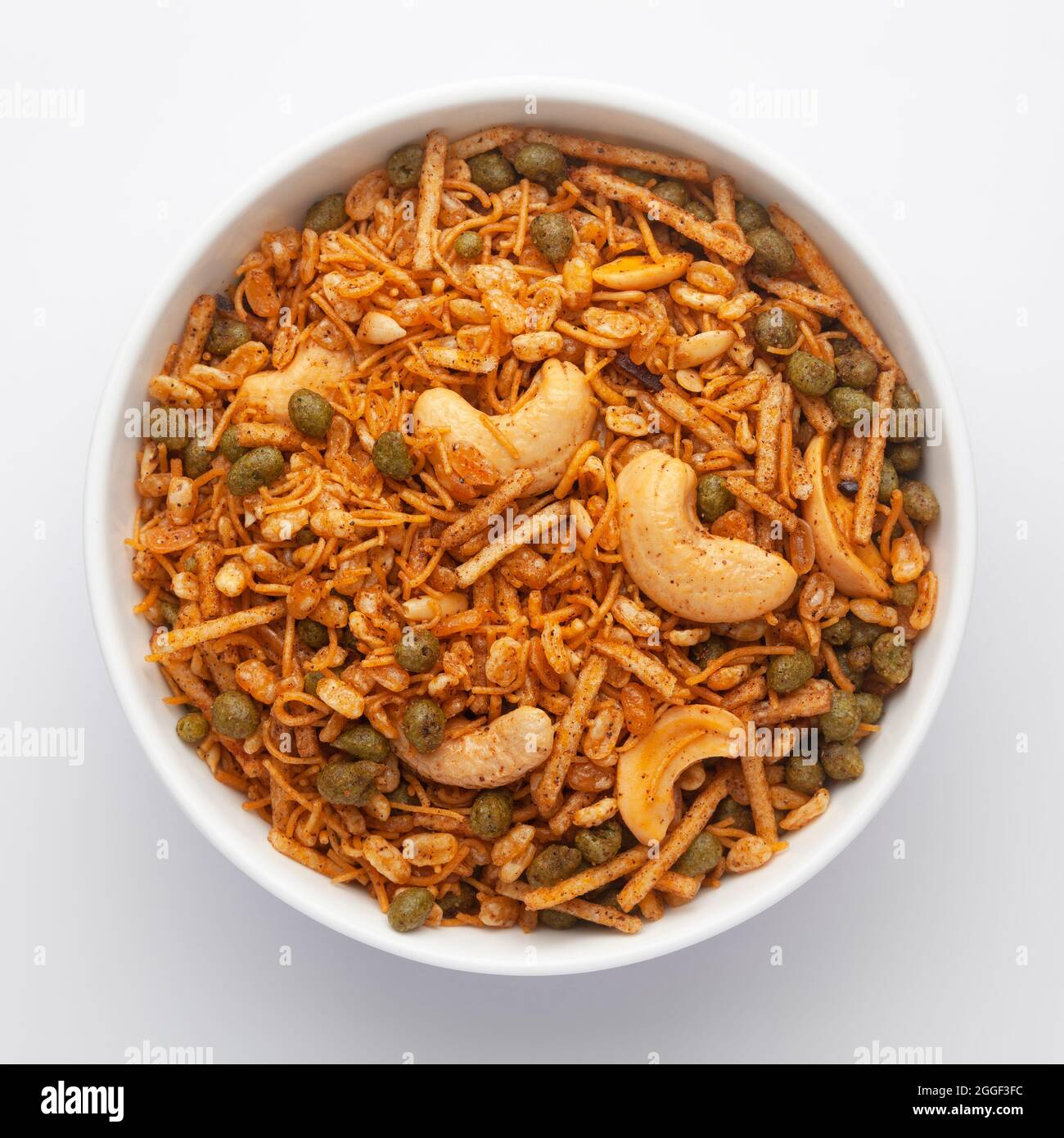 Close-Up of Hot spicy Kashmiri Mixture (Namkeen) snacks in a white ...