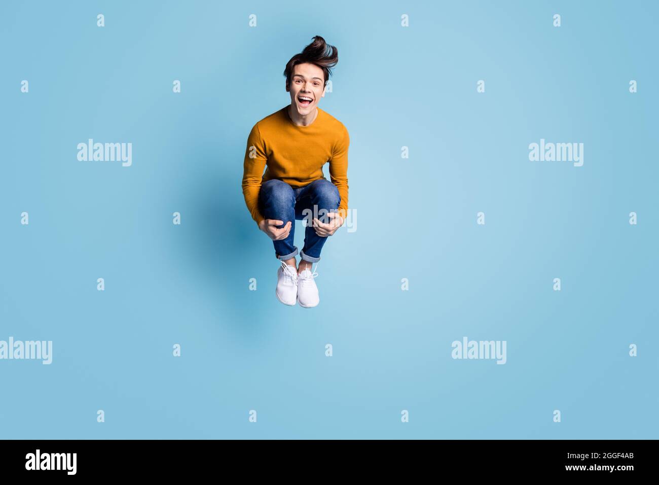 Full size photo of cool brunet young guy jump bomb into water pool wear ...