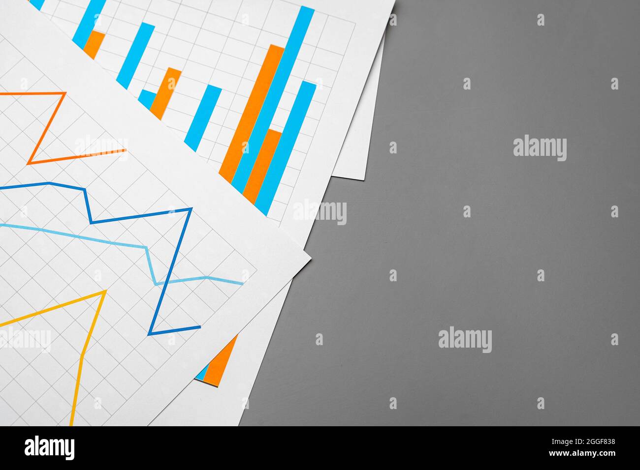 Business graph analysis documents on gray background Stock Photo - Alamy