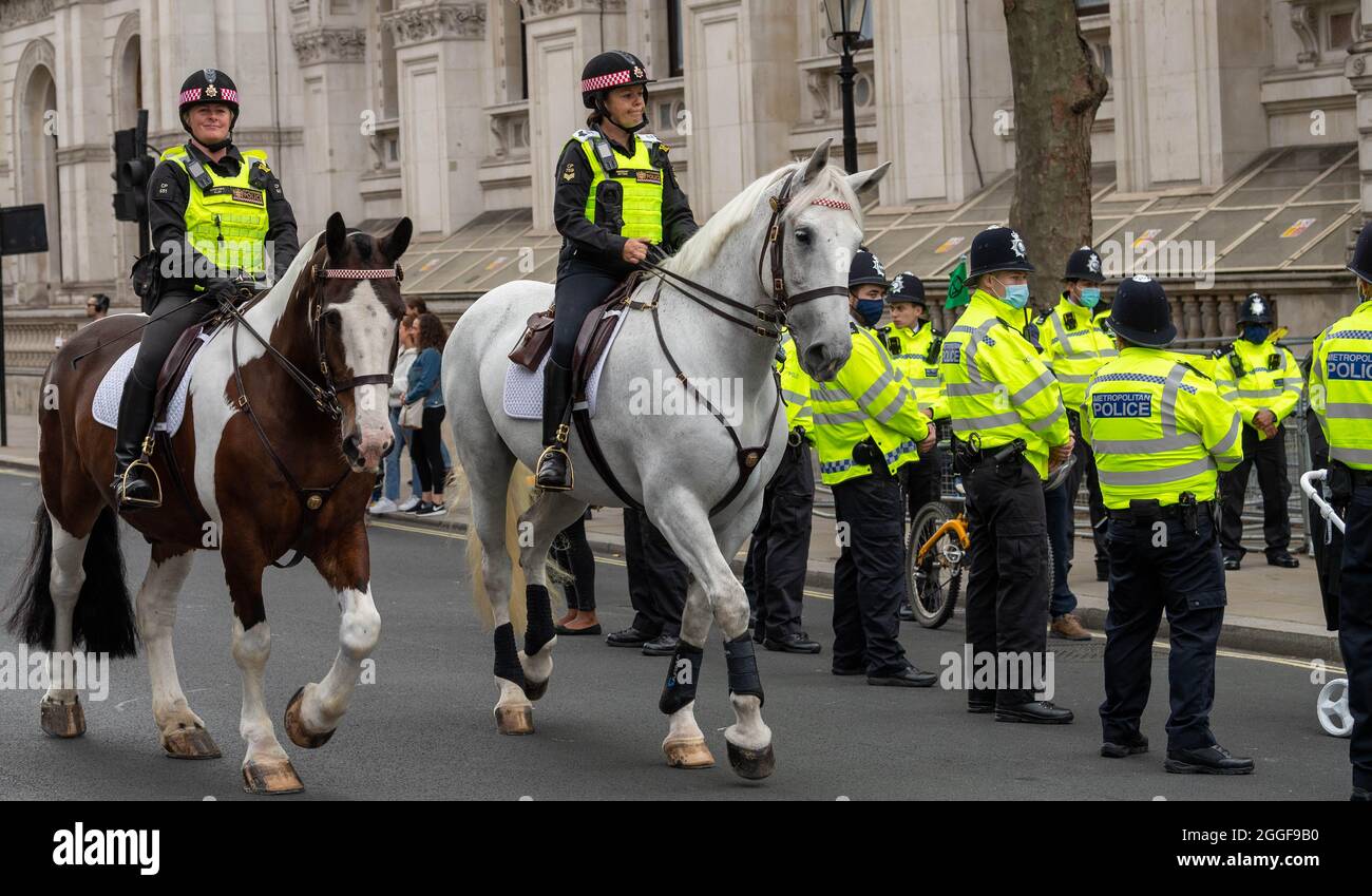 London, UK. 31st Aug, 2021. XR protesters stage a sit down protest ...