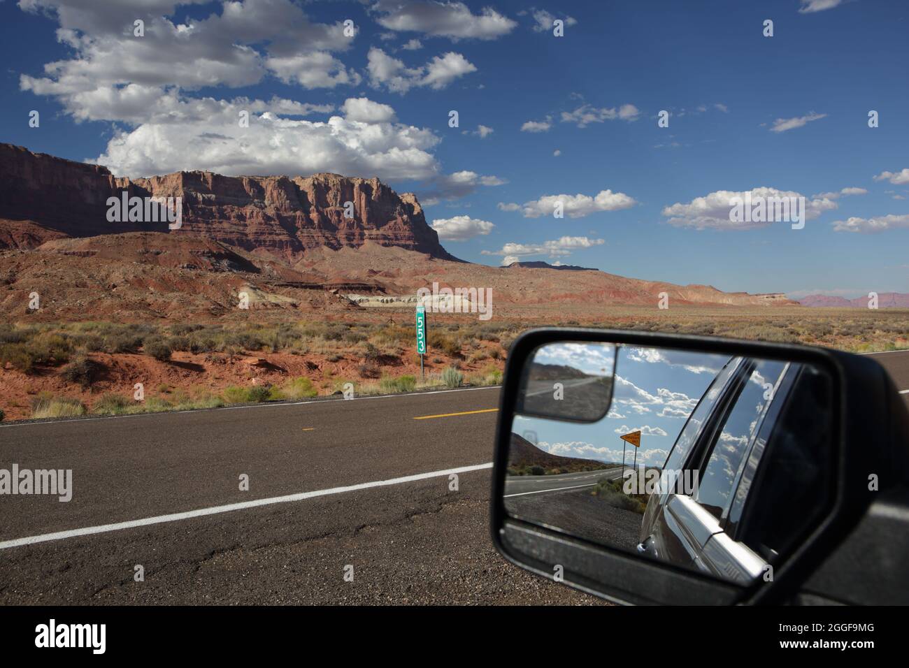 View in a car wing mirror of the Vermilion Cliffs National Monument ...