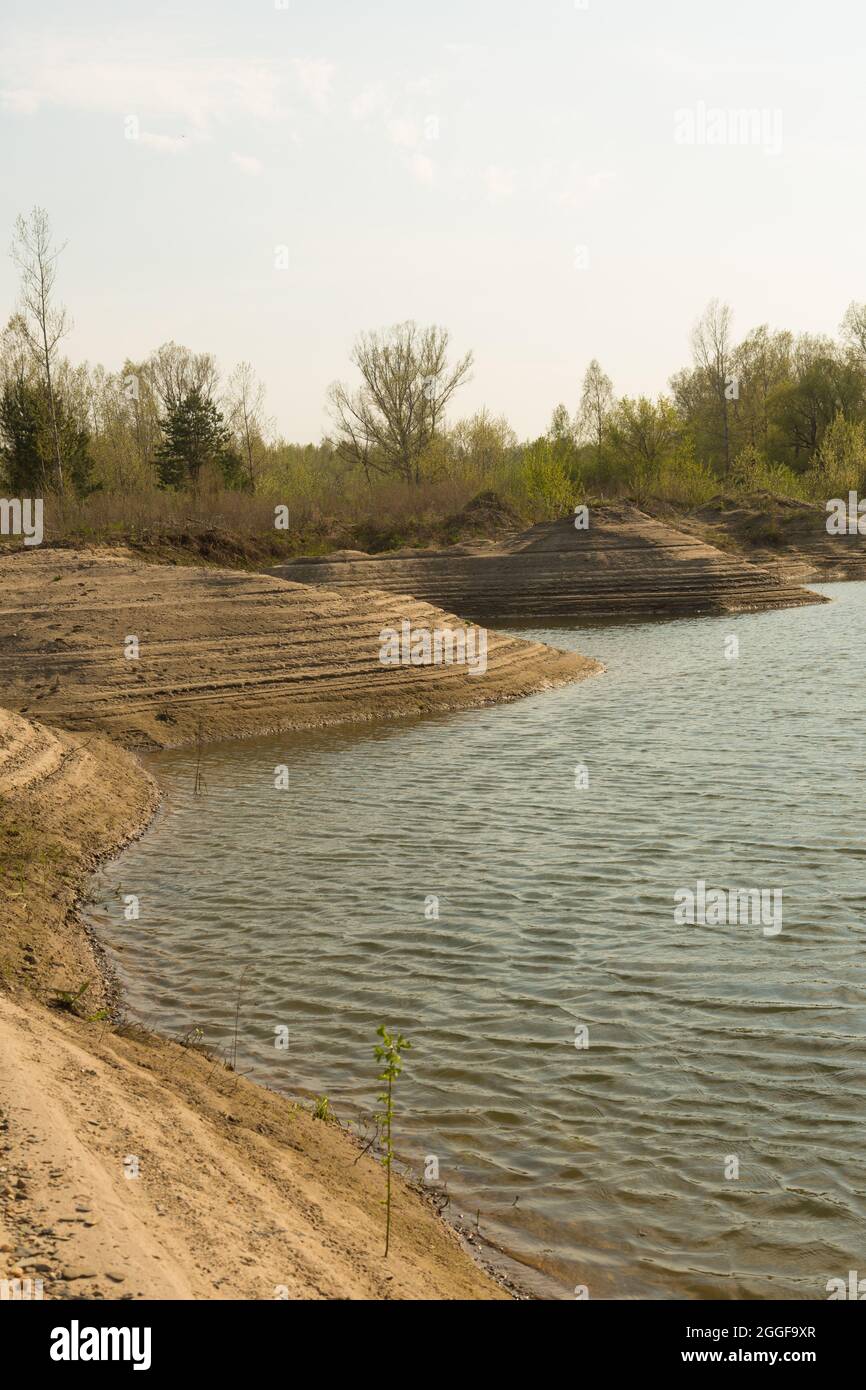 Sand quarry, lagoon Industry Mountains landscape Stock Photo - Alamy