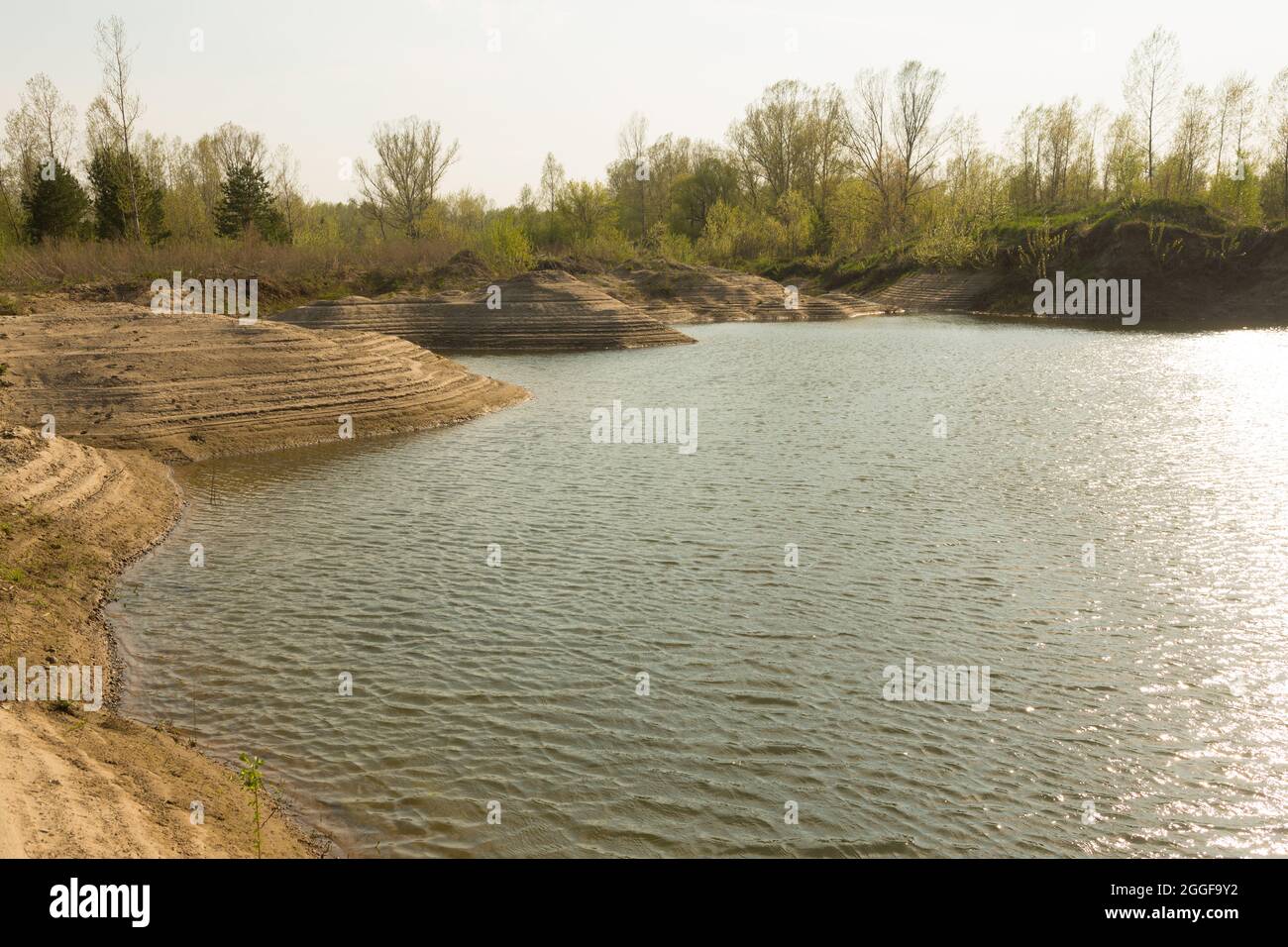 Sand quarry, lagoon Industry Mountains landscape Stock Photo - Alamy