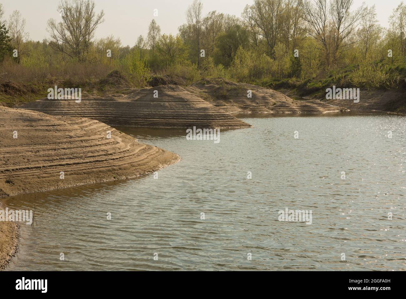 Sand quarry, lagoon Industry Mountains landscape Stock Photo - Alamy