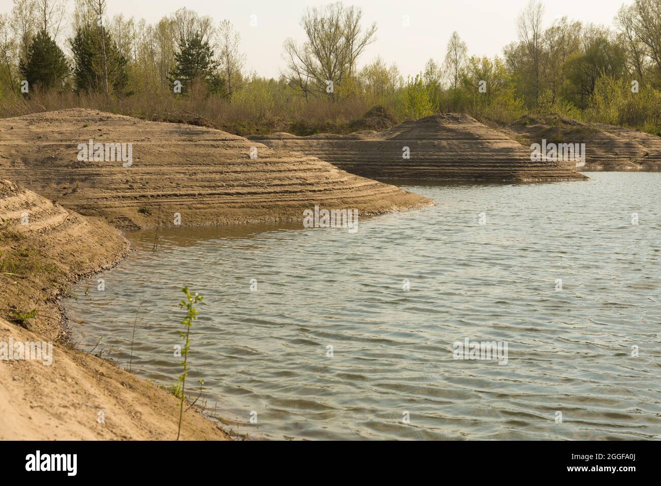 Sand quarry, lagoon Industry Mountains landscape Stock Photo - Alamy