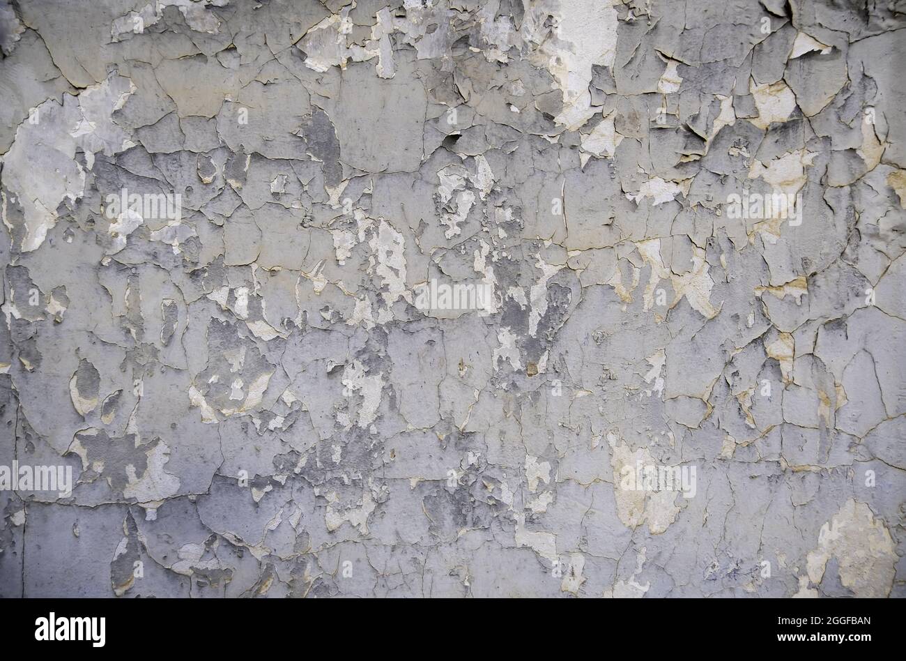 Detail of old damaged and ruined paint, abandonment and passage of time ...