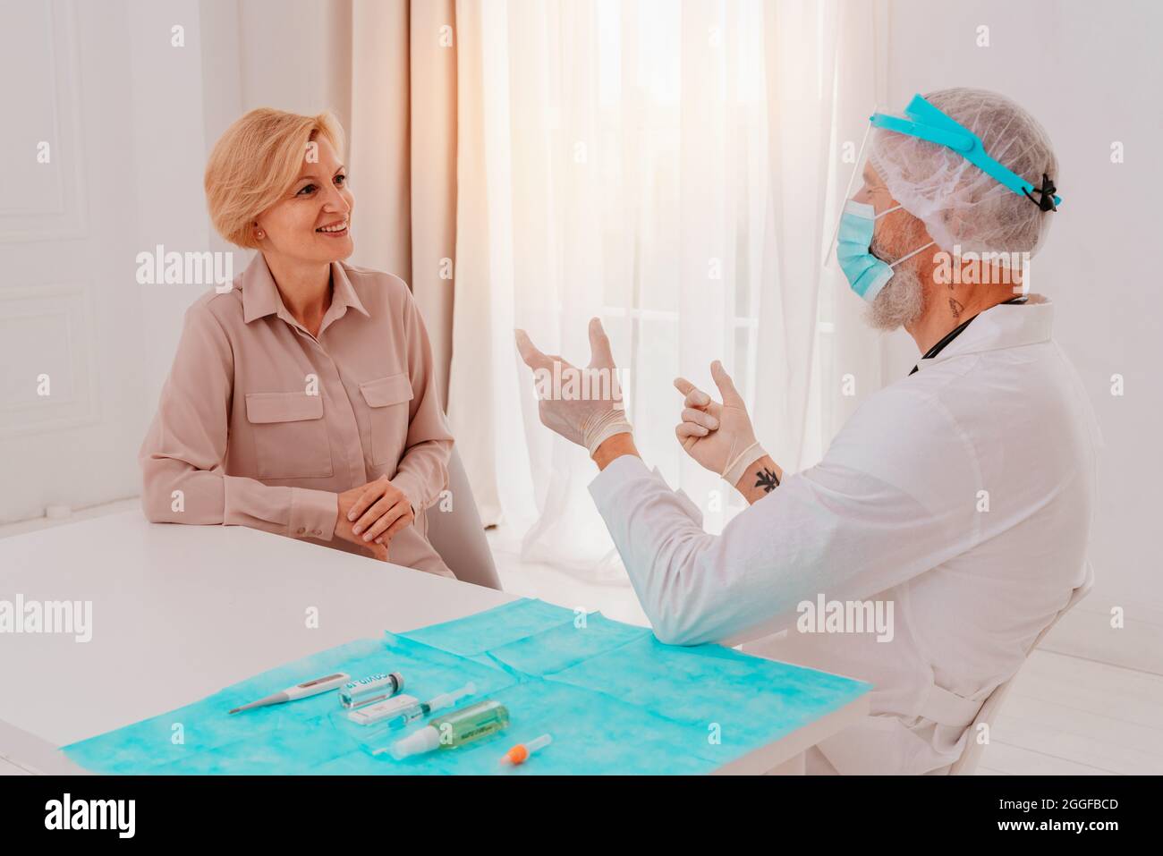 Doctor explain to the patient information about covid-19 virus Stock ...