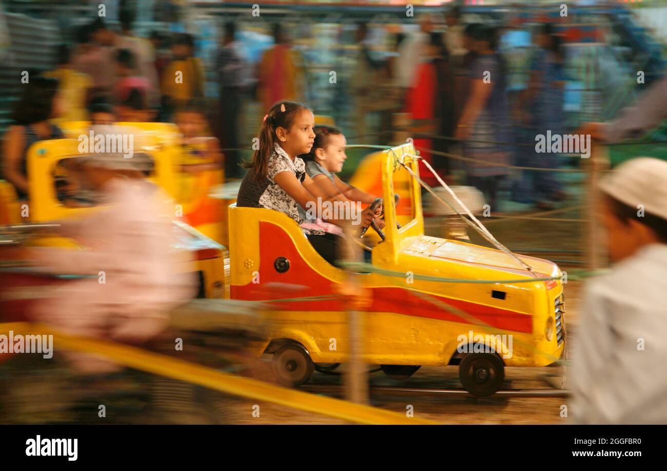 Children enjoy at a fair during the Dussehra festival in New delhi ...