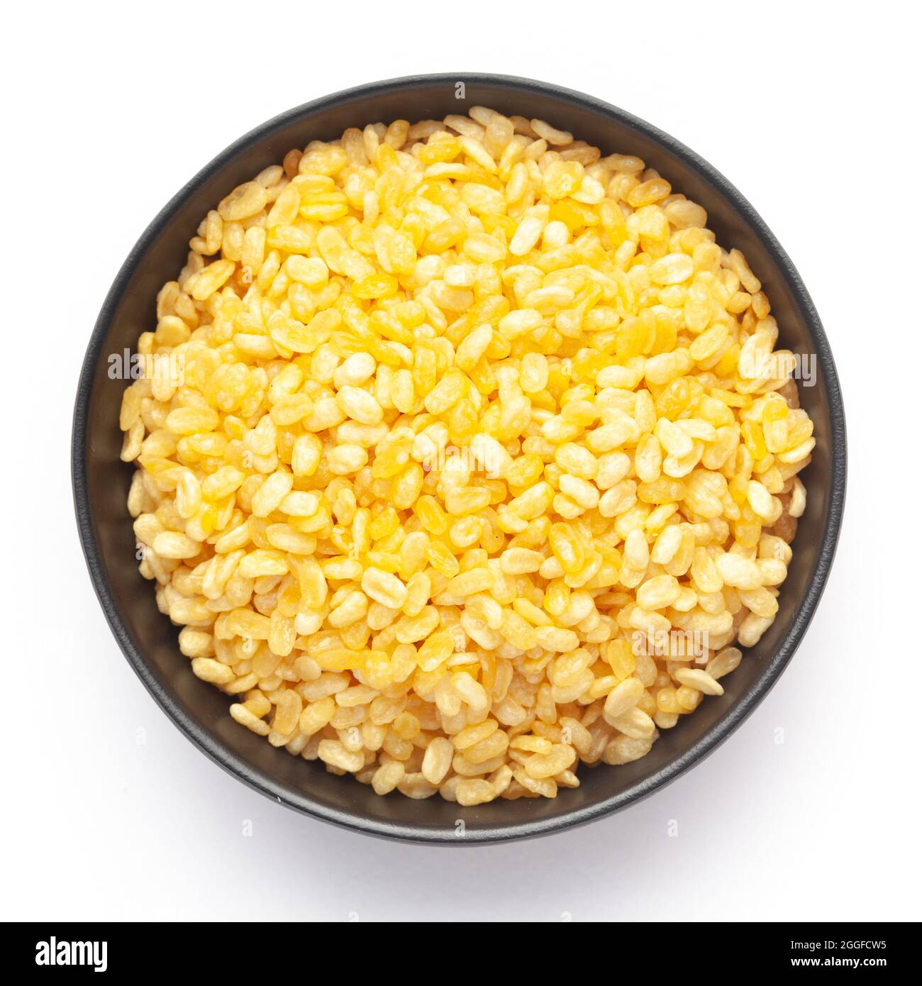 Close-Up of Crunchy Moong Dal in a black Ceramic bowl, made with roasted Mung bean. Indian spicy ...