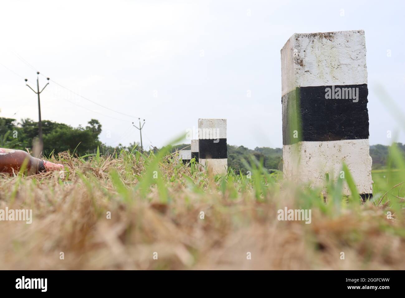 Black and white traffic sign on road side Stock Photo - Alamy