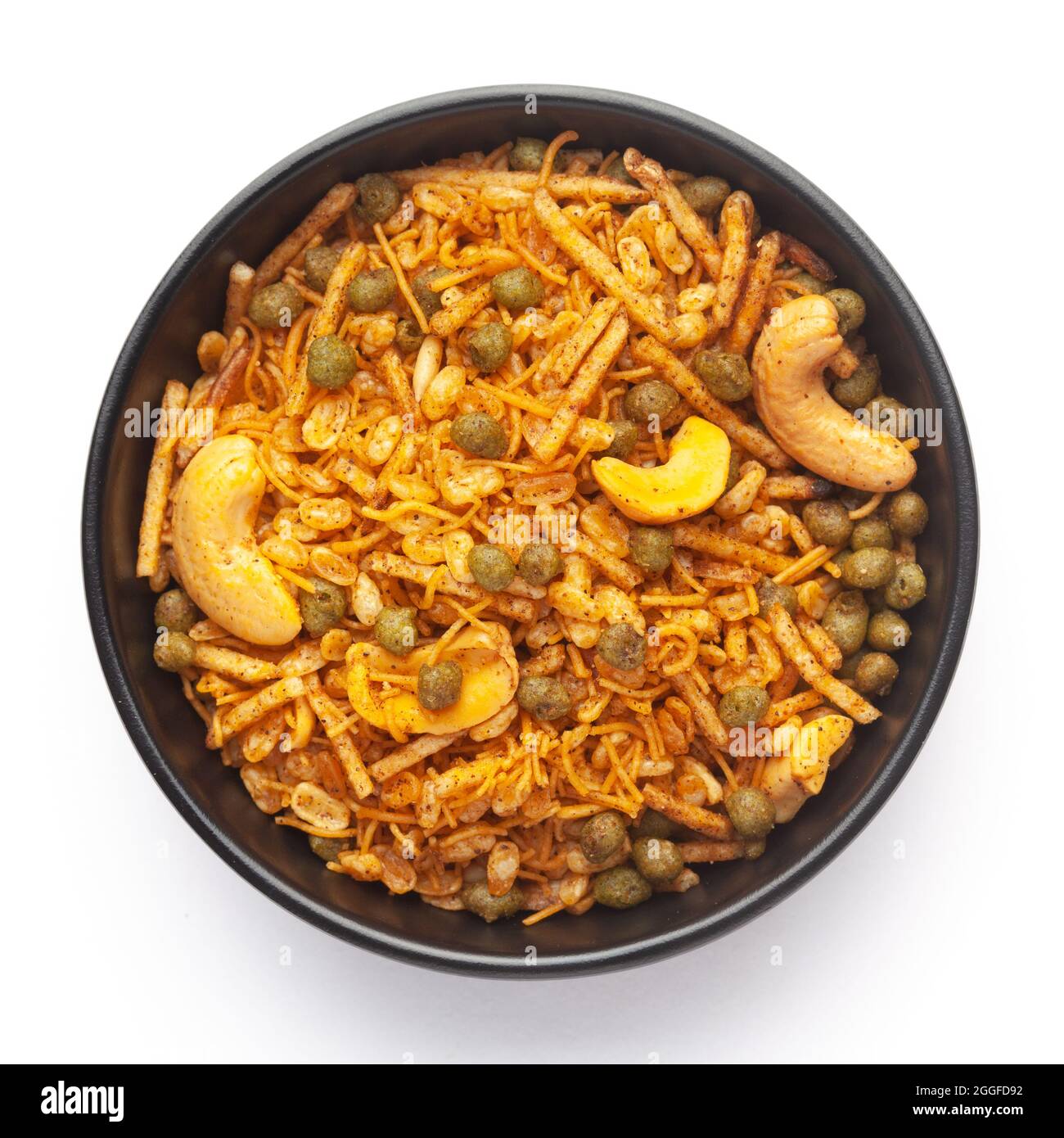 Close-Up of Hot spicy Kashmiri Mixture (Namkeen) snacks in a black ...