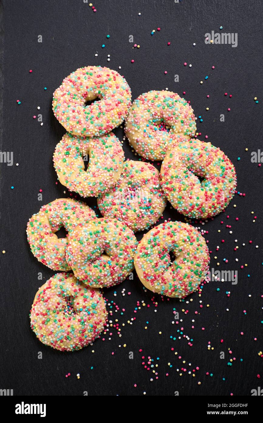Prepared dry biscuits with sugar grains of different colors Stock Photo ...