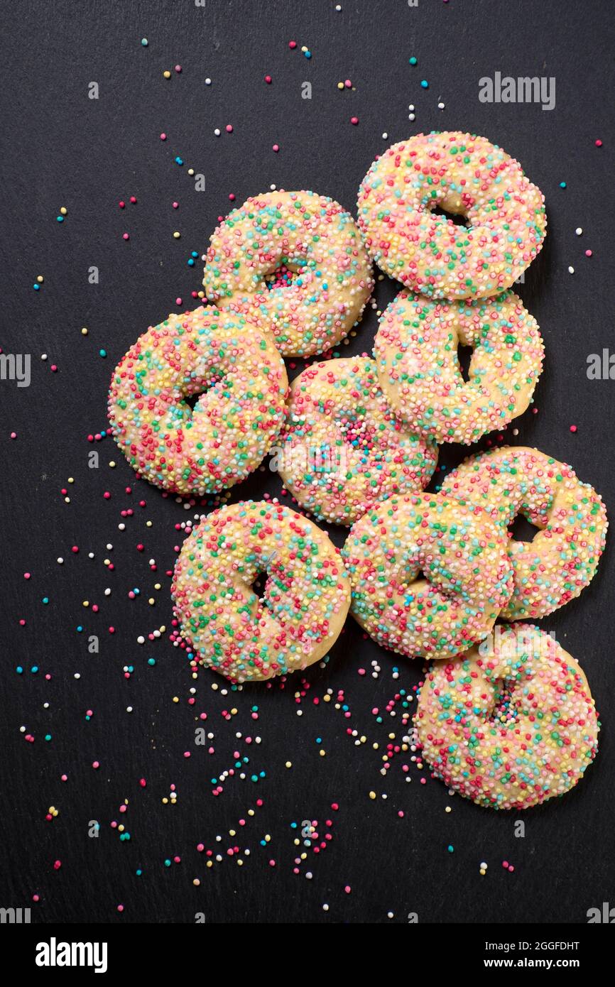 Prepared dry biscuits with sugar grains of different colors Stock Photo ...