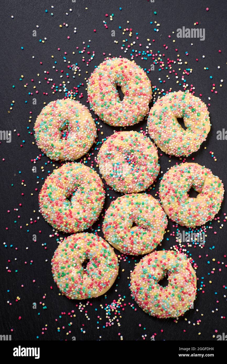 Prepared dry biscuits with sugar grains of different colors Stock Photo ...