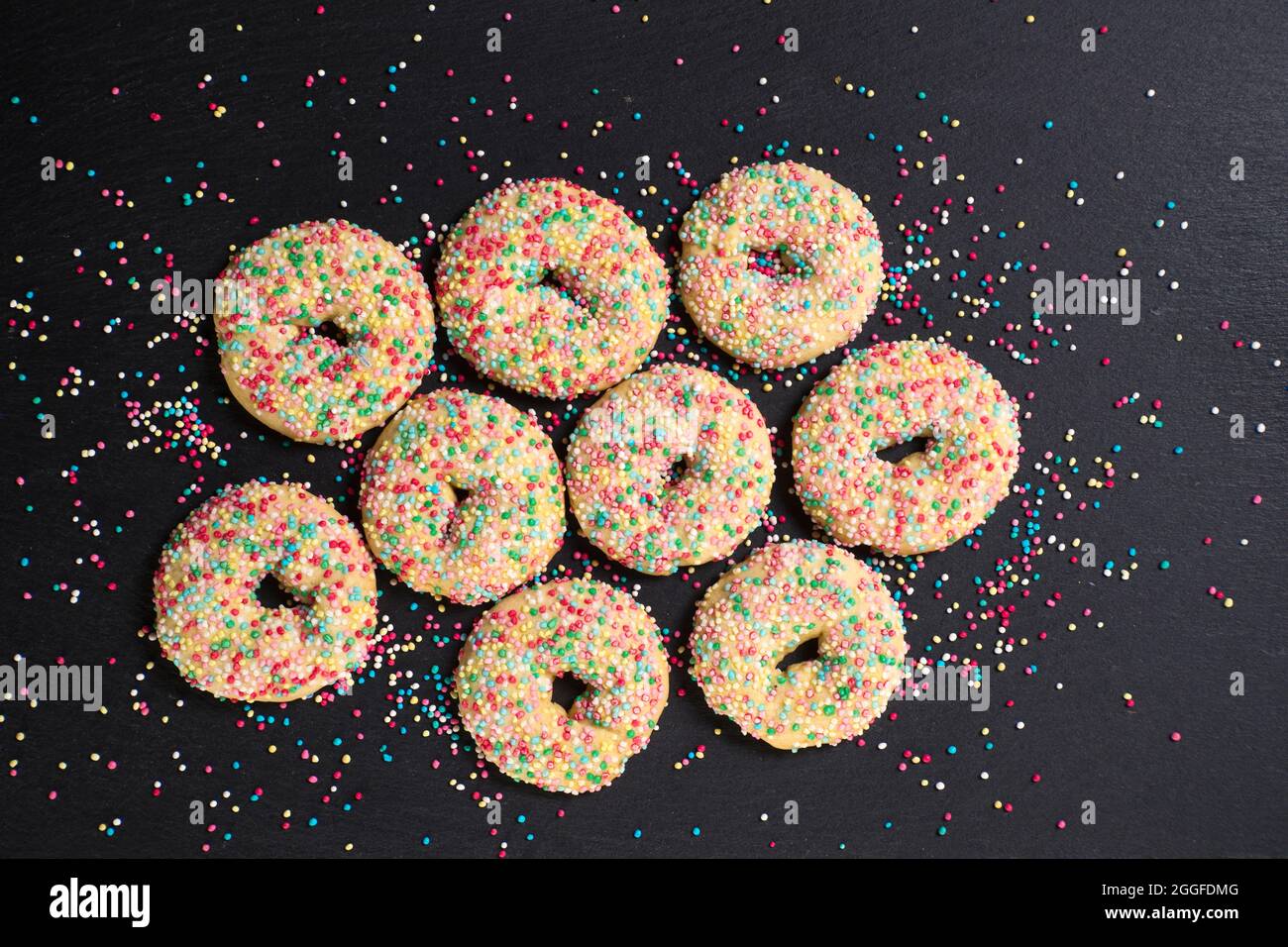 Prepared dry biscuits with sugar grains of different colors Stock Photo ...