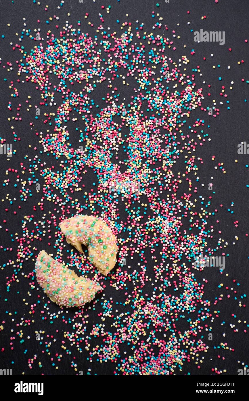 Prepared dry biscuits with sugar grains of different colors Stock Photo ...