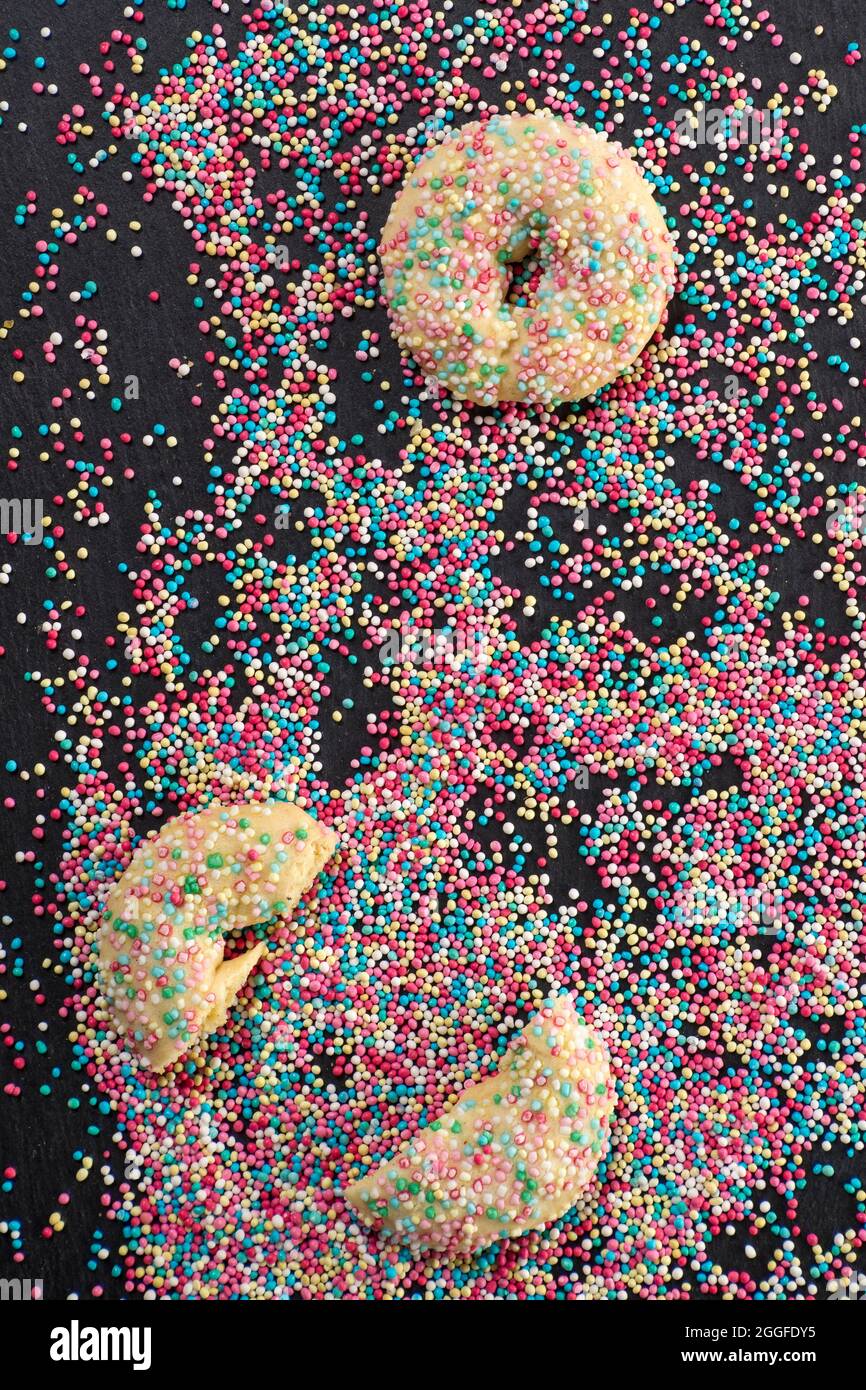 Prepared dry biscuits with sugar grains of different colors Stock Photo ...