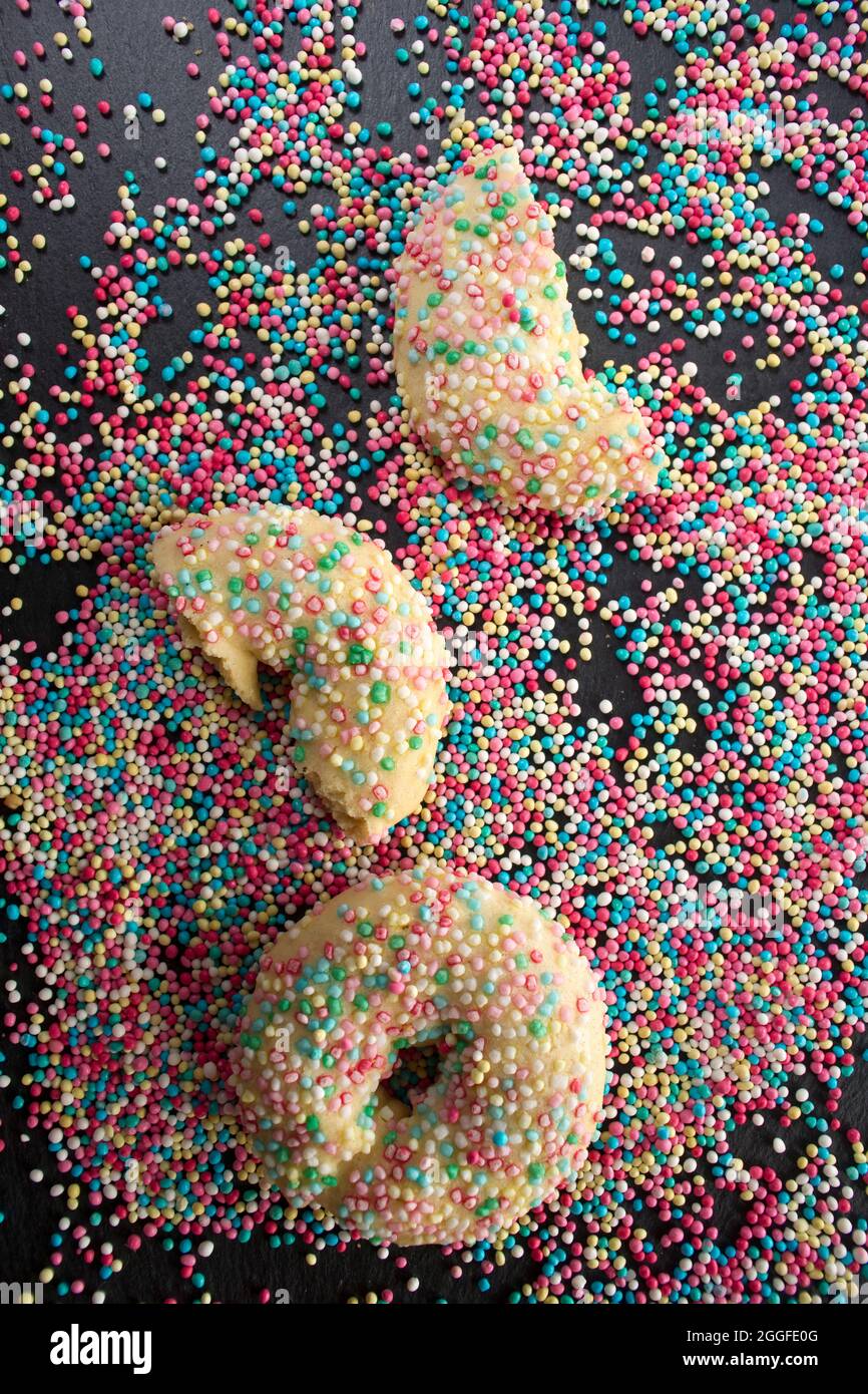 Prepared dry biscuits with sugar grains of different colors Stock Photo ...