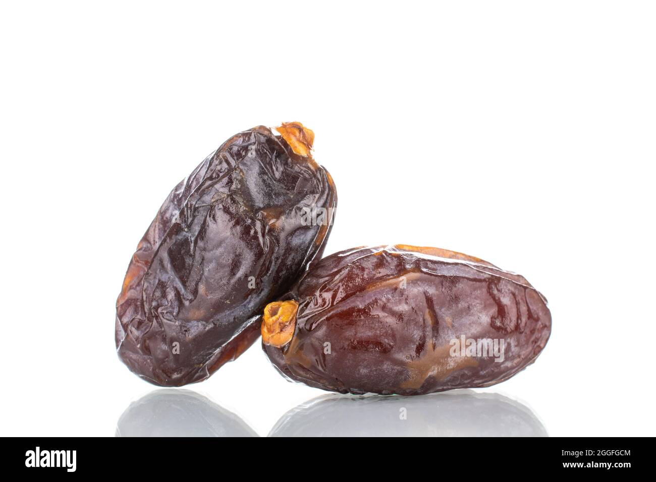 Two royal dates, close-up, isolated on white Stock Photo - Alamy