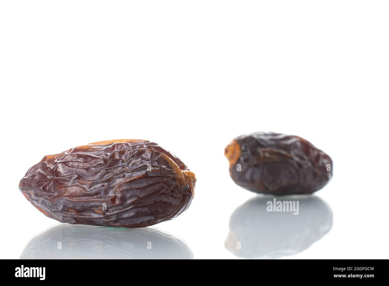 Two royal dates, close-up, isolated on white Stock Photo - Alamy