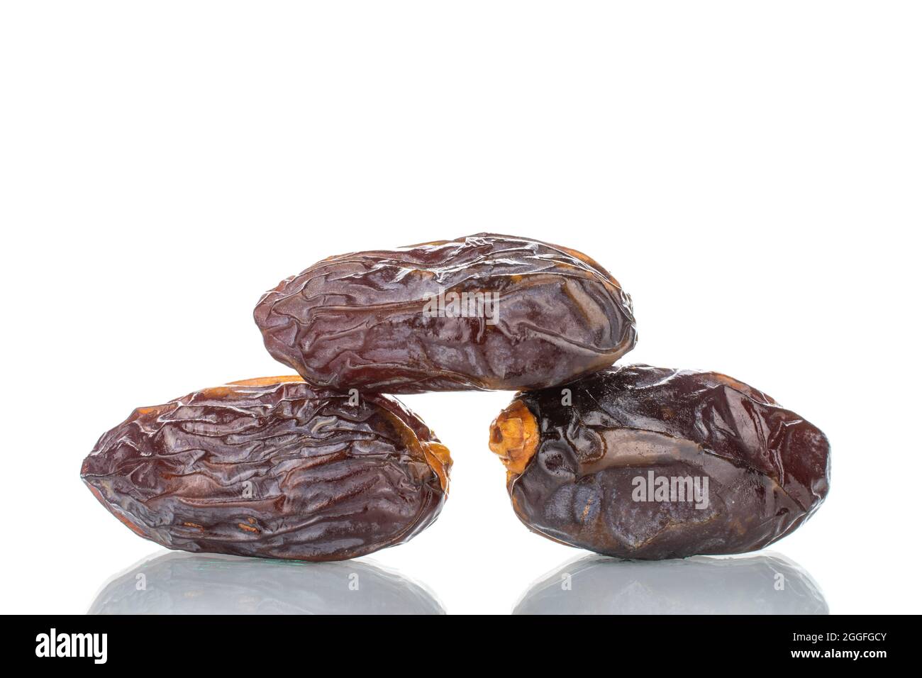 Three royal dates, close-up, isolated on white Stock Photo - Alamy