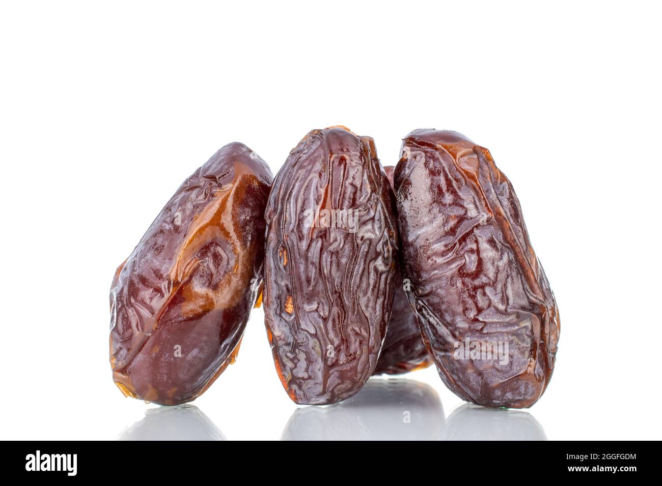 Several royal dates, close-up, isolated on white Stock Photo - Alamy