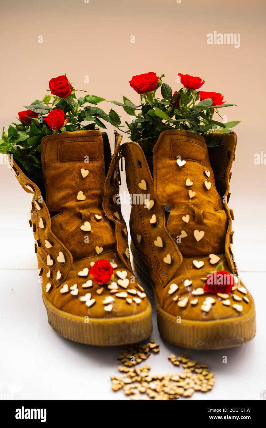 old shoes with hearts and roses, background Stock Photo - Alamy