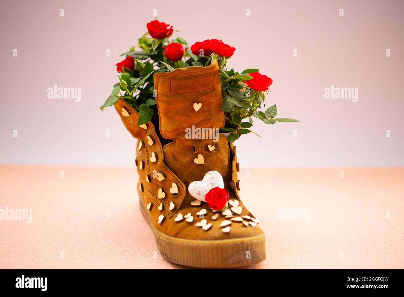 old shoes with hearts and roses, background Stock Photo - Alamy