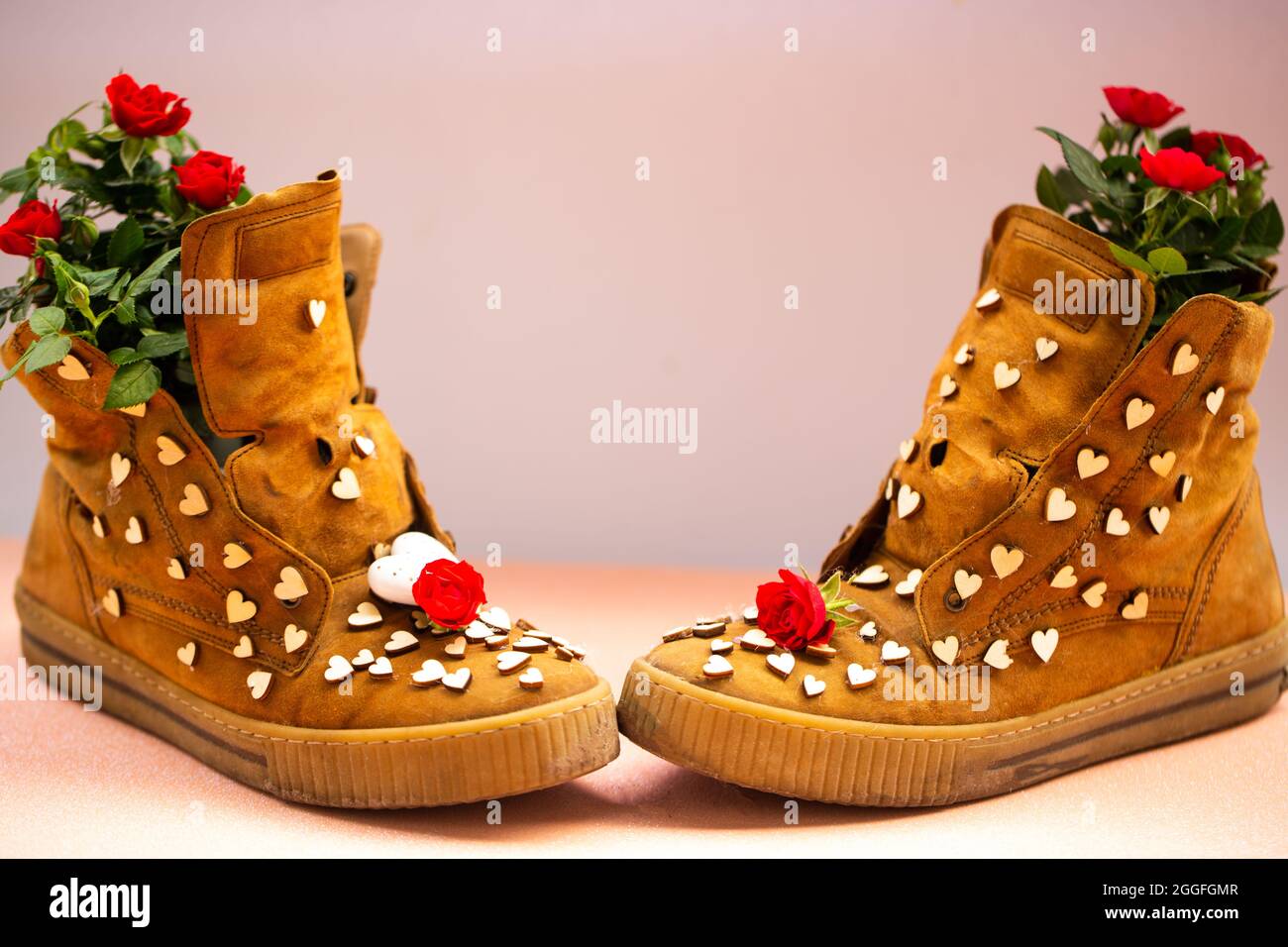 old shoes with hearts and roses, background Stock Photo - Alamy