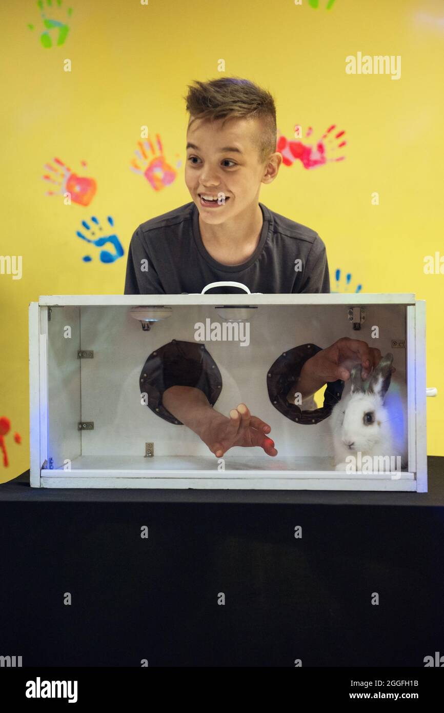 Blind guess game by touch . Young boy guesses by touch that he does not ...