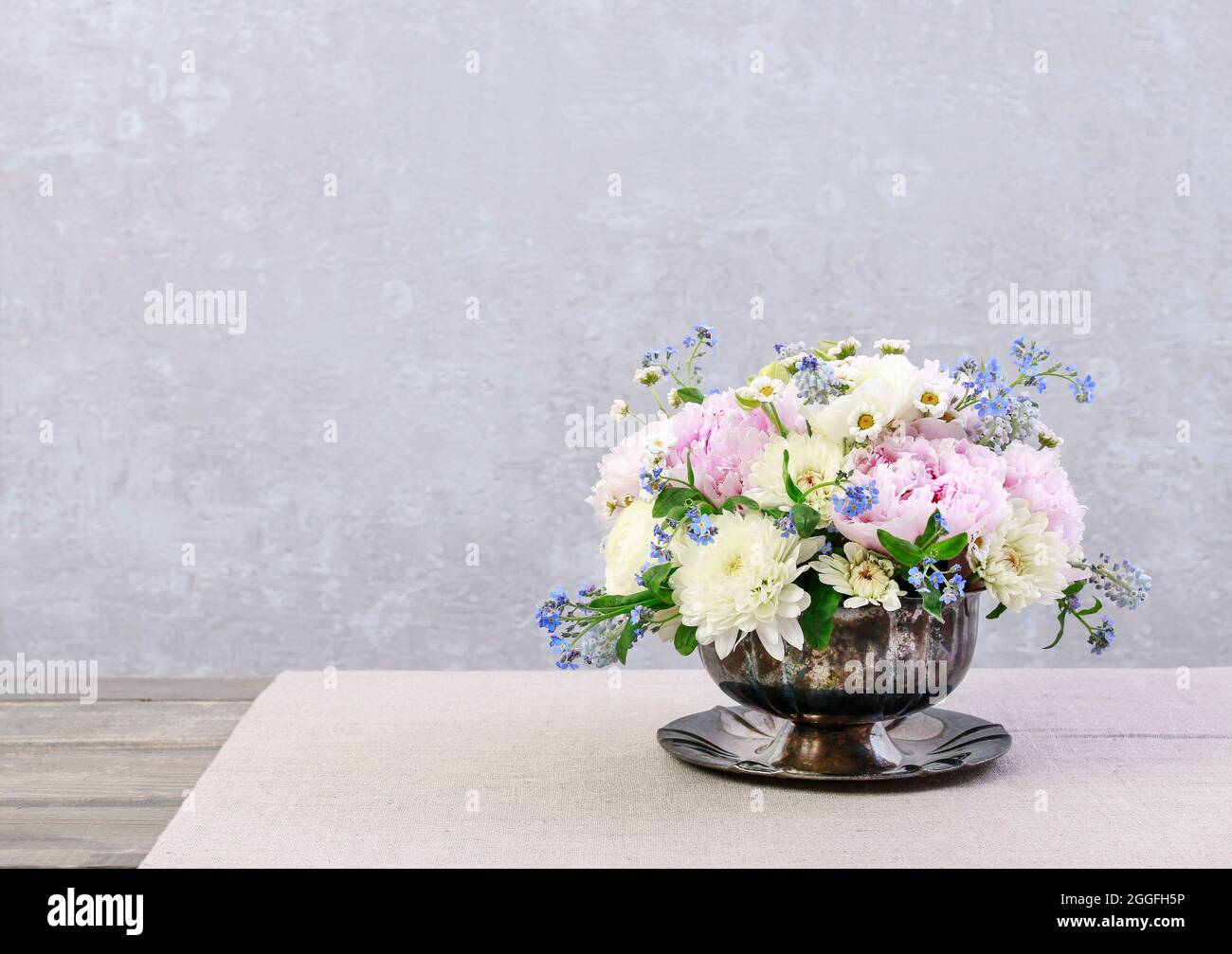 Floral arrangement with pink peonies, ranunculus flowers, white ...