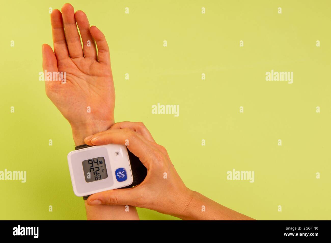 woman's hand measuring her blood pressure Stock Photo - Alamy