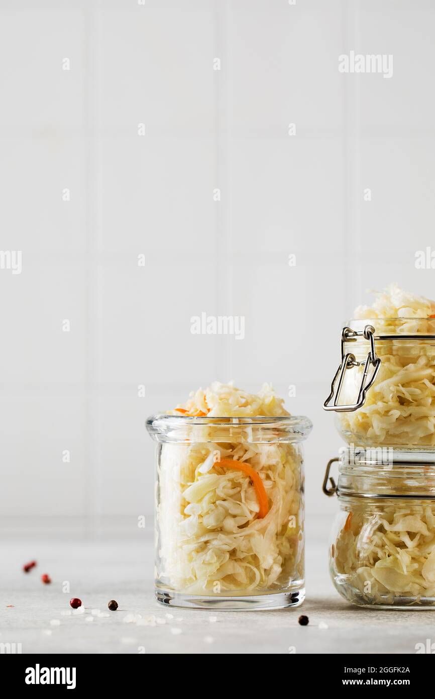 Sauerkraut in glass jars. Fermentation and canning of vegetables. Copy ...