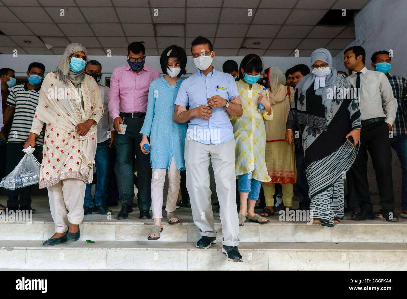 Bangladeshi American Sharif Imran and his two Japanese daughters coming ...