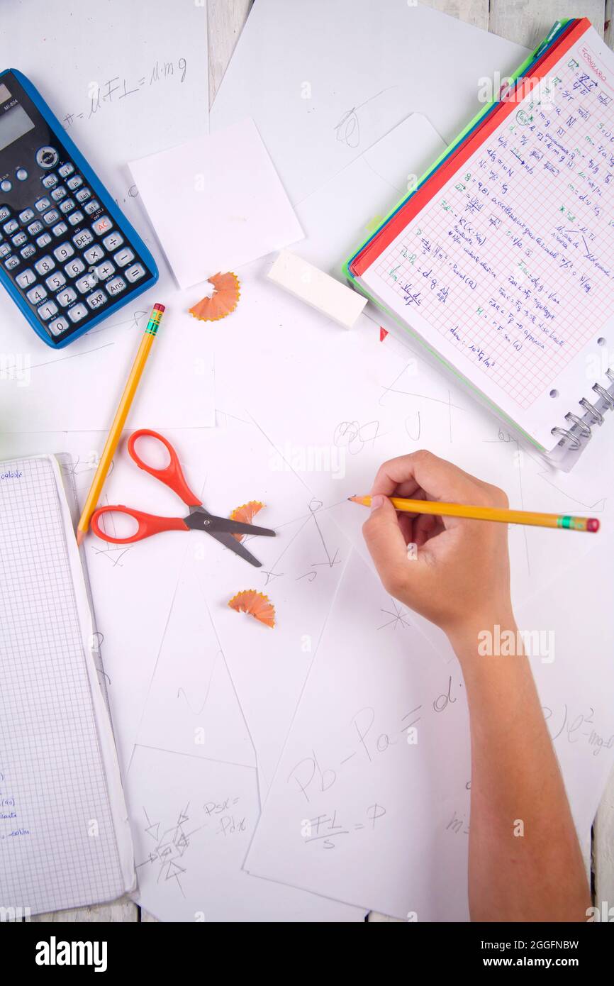 Study table with sheets for applications of a problem Stock Photo - Alamy