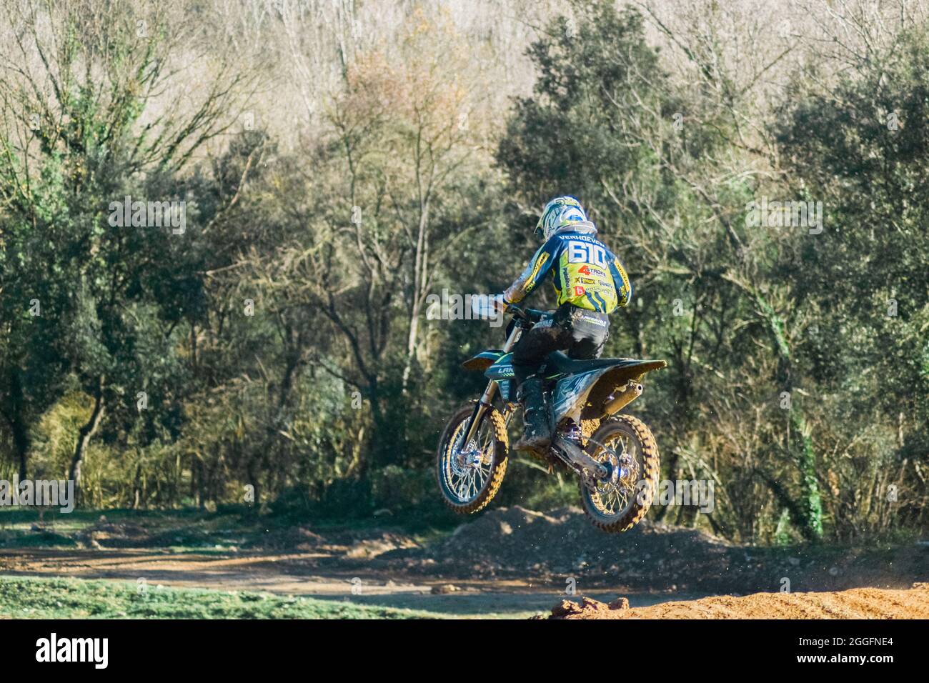Boy riding motorcycle in forest hi-res stock photography and images - Alamy